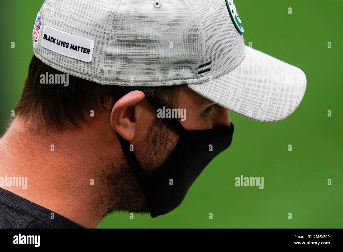 New York Jets head coach Adam Gase wears a cap bearing a "BLACK LIVES ...