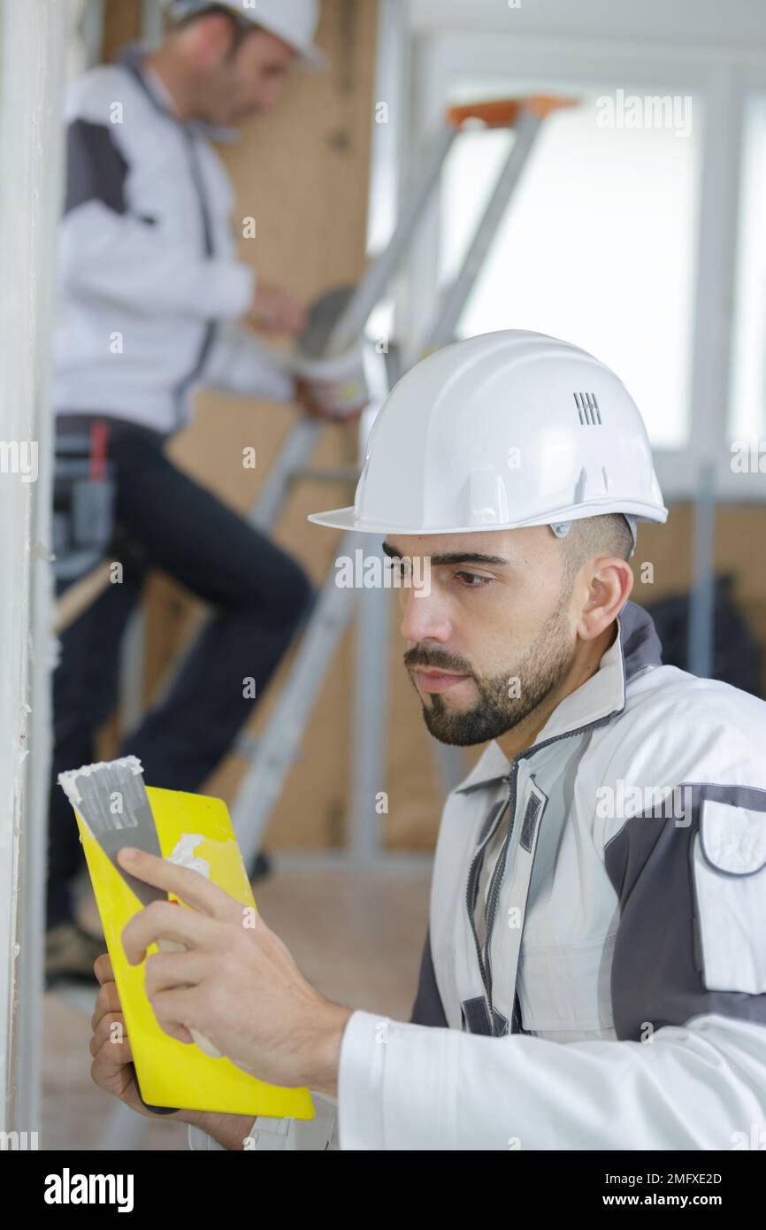portrait of plasterers at work Stock Photo - Alamy