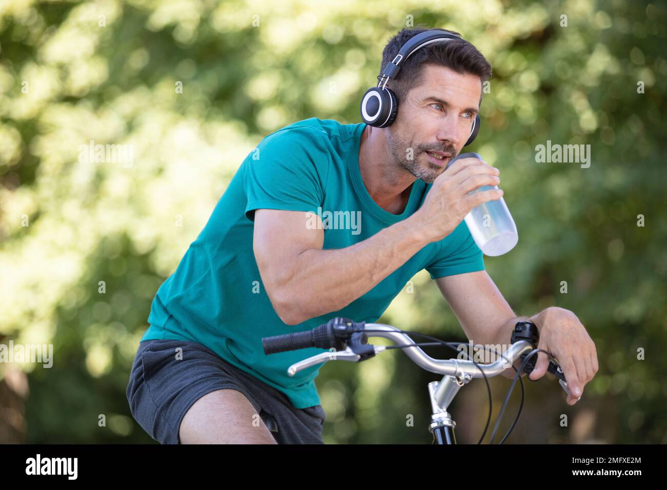Girl cyclist drink water hi-res stock photography and images - Alamy