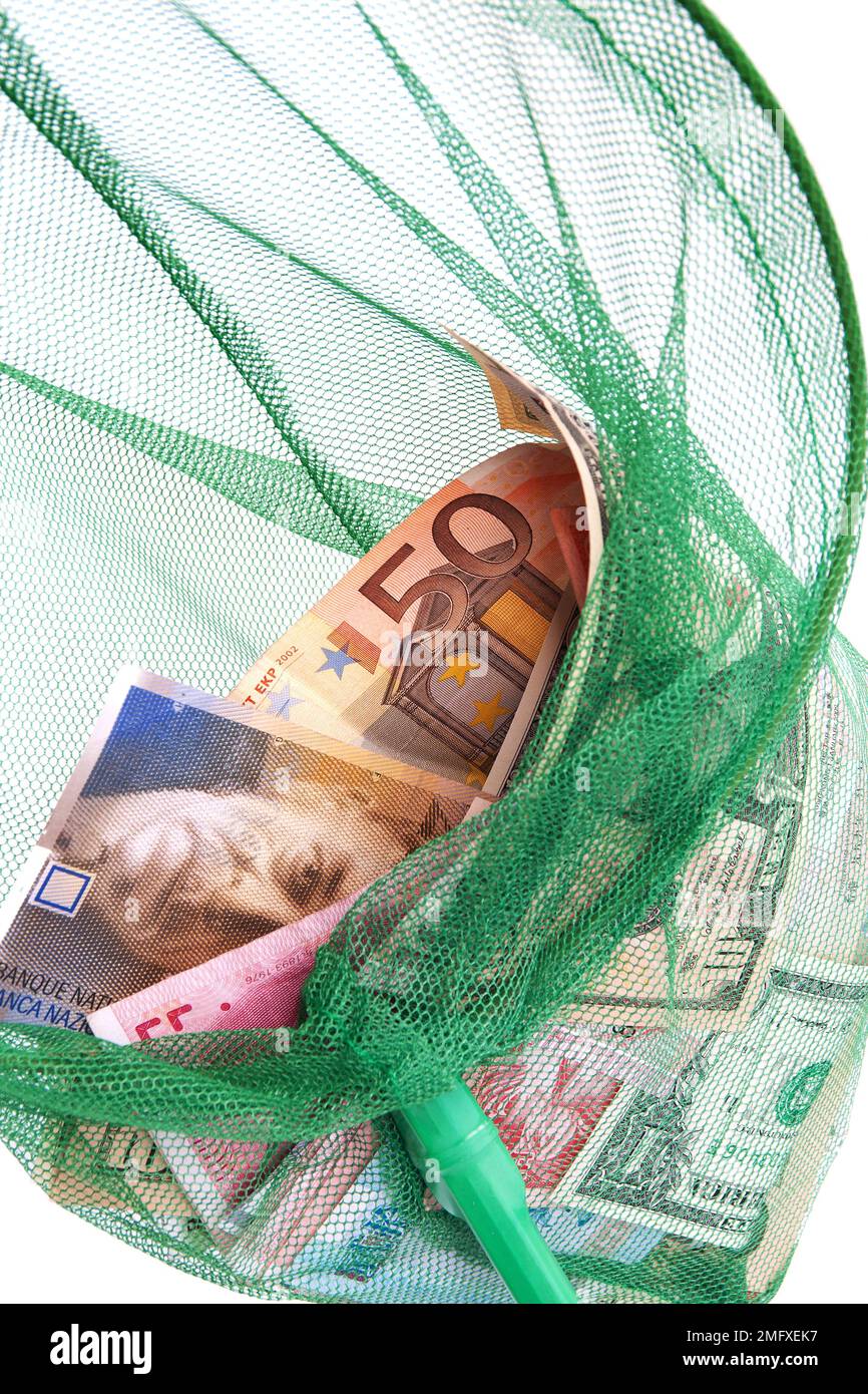 Different currencies caught in a fishing net Stock Photo - Alamy