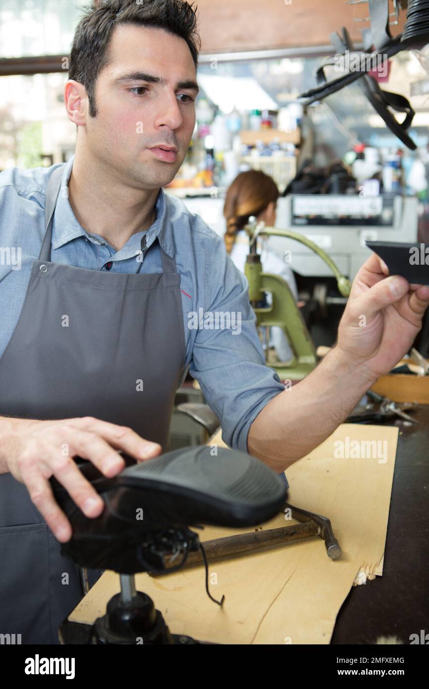 Fixing shoes hi-res stock photography and images - Alamy