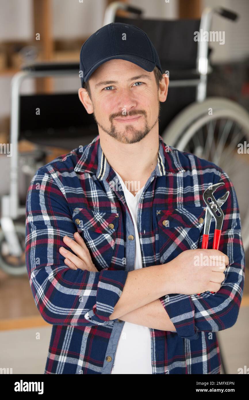 portrait of man after having fixed a wheel Stock Photo - Alamy