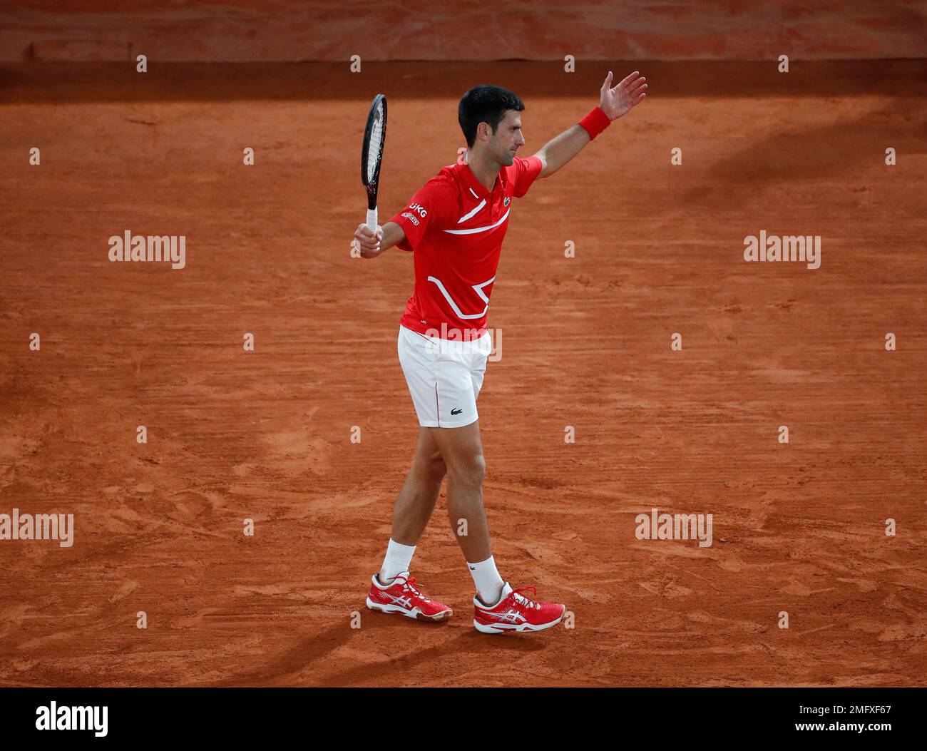 Serbia's Novak Djokovic reacts after missing a shot against Spain's Rafael Nadal in the final ...