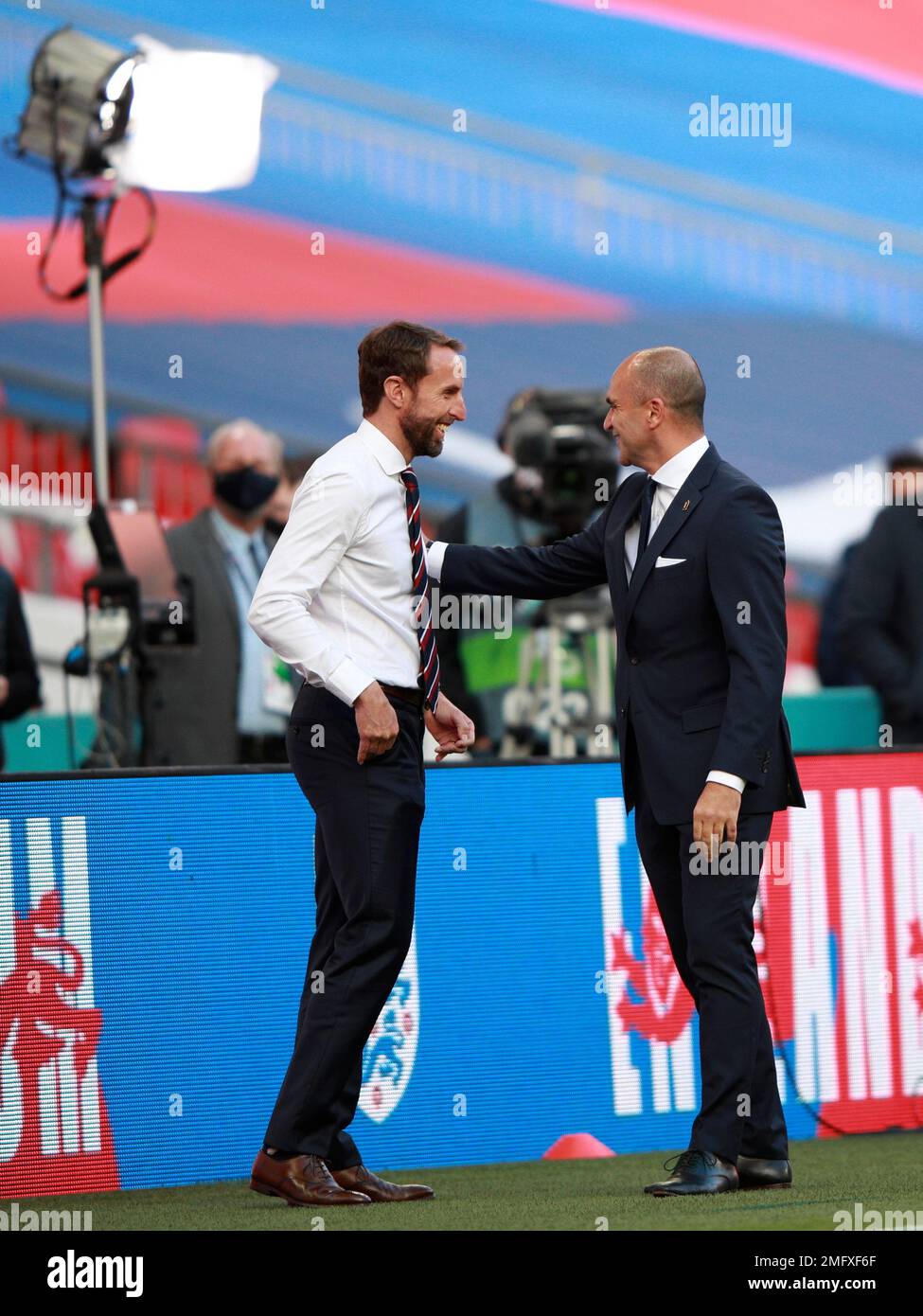 England coach Gareth Southgate, left, chats with Belgium's coach ...