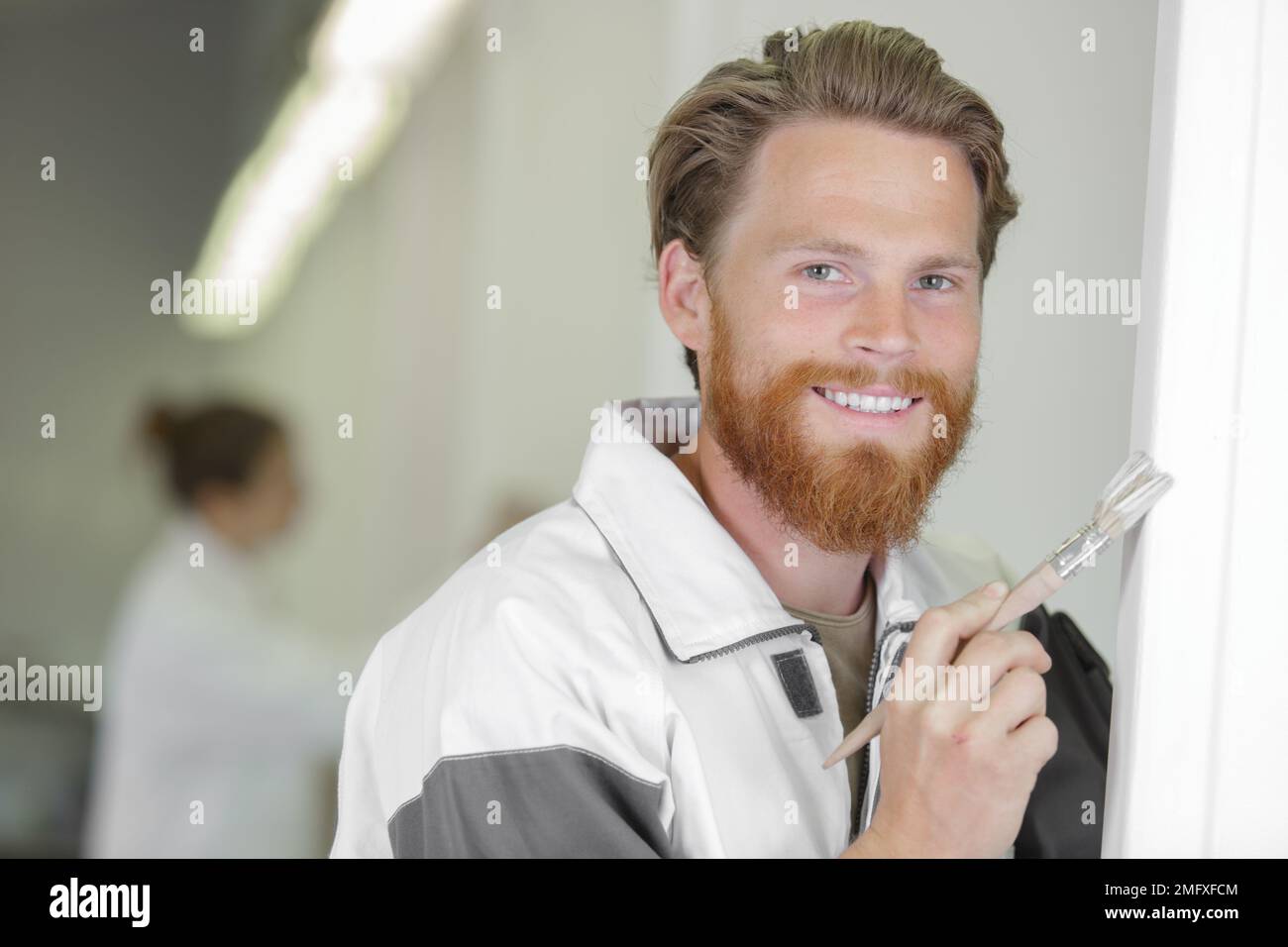Happy man paint brush hi-res stock photography and images - Alamy