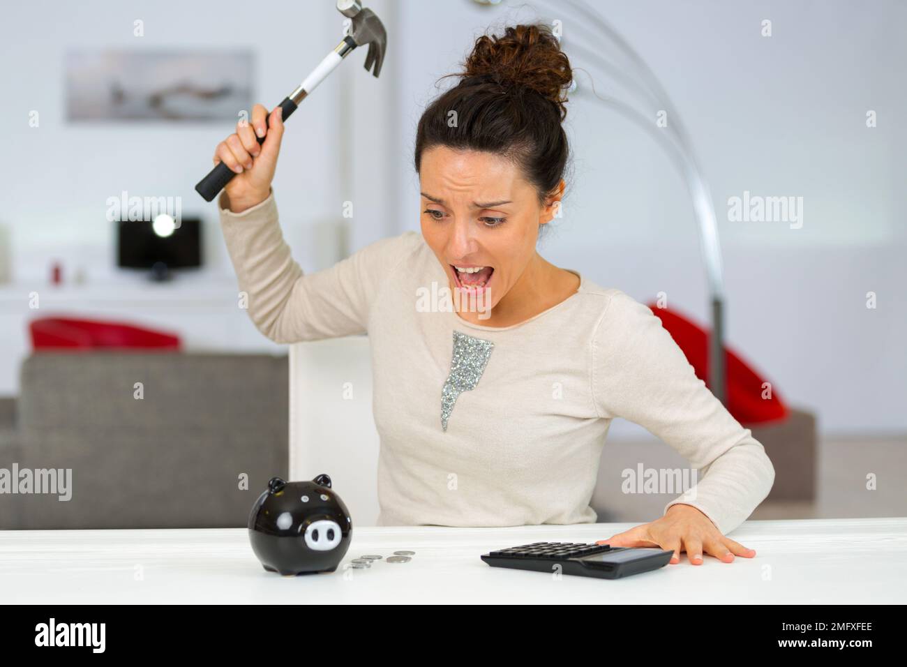 Hammering coins hi-res stock photography and images - Alamy