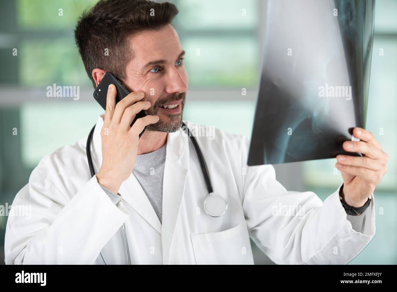 male radiologist on the phone in the clinic Stock Photo - Alamy