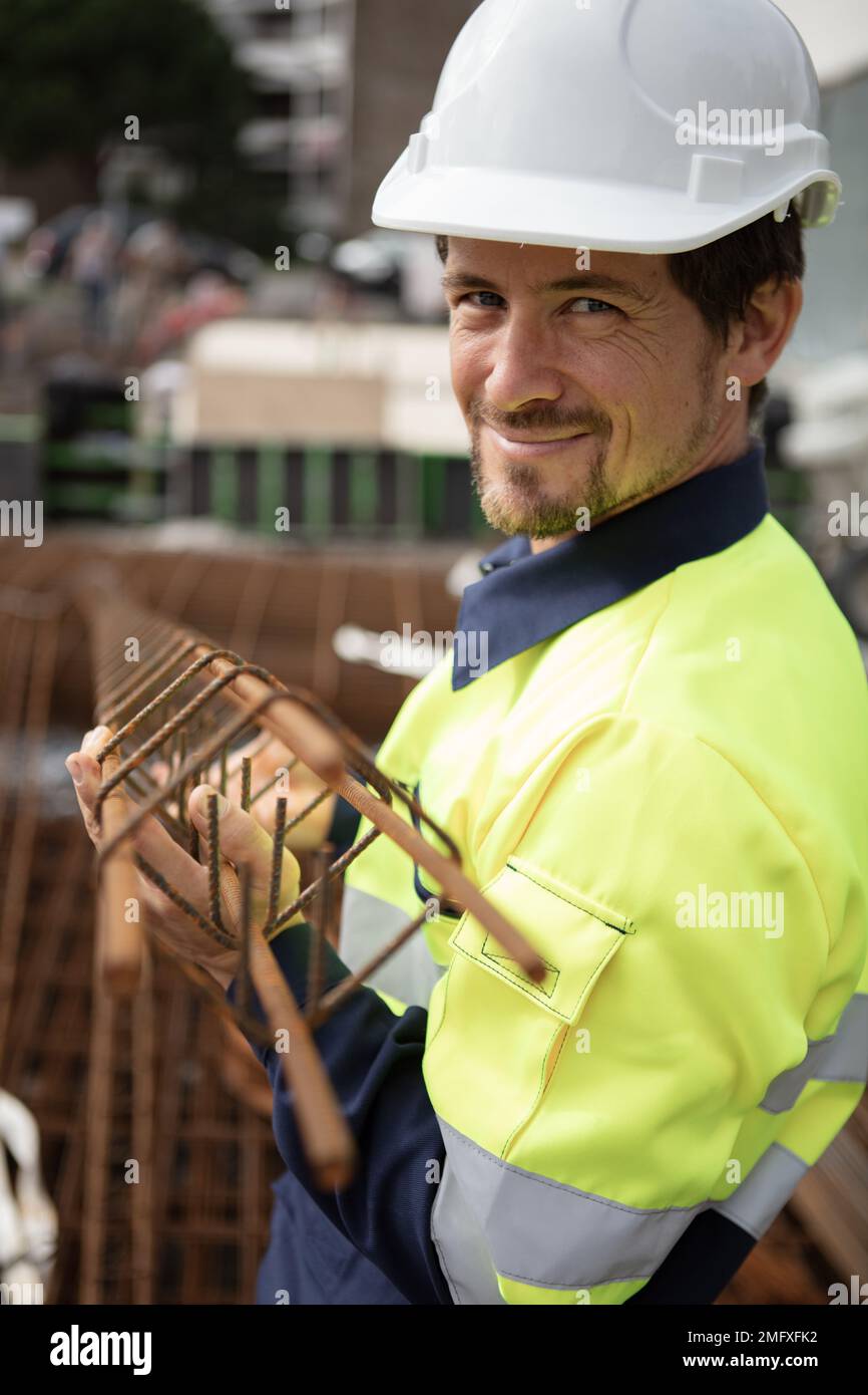 male builder making building foundations Stock Photo - Alamy