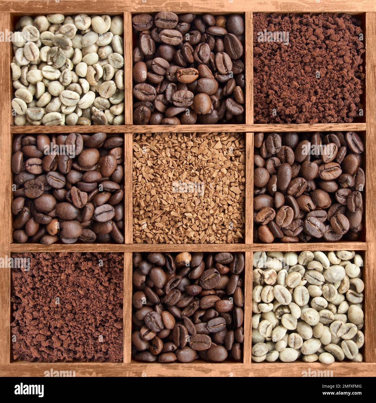 different coffee forms in wooden box (raw and roasted beans, instant ...
