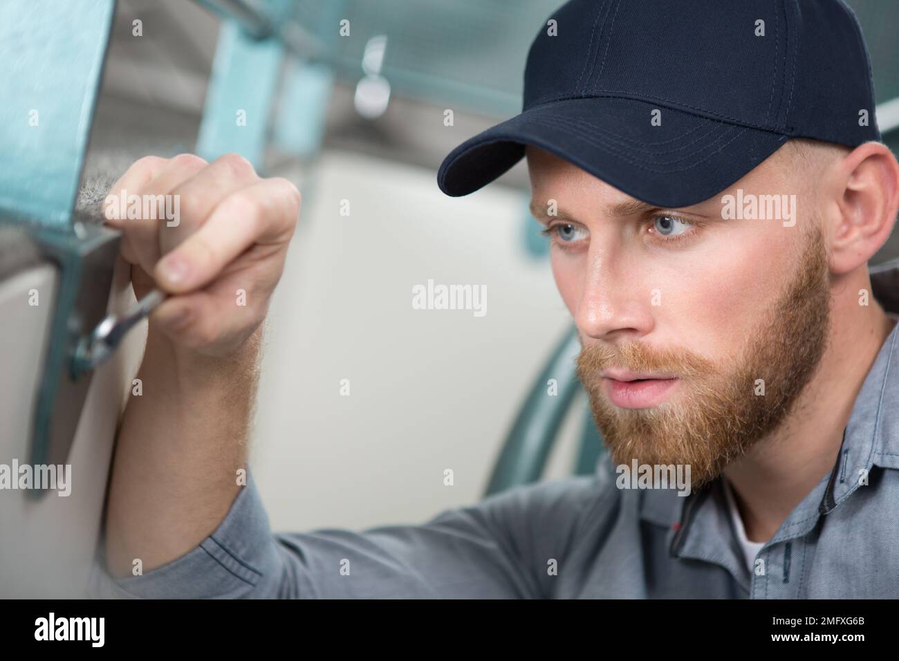 a man worker using a tool Stock Photo - Alamy