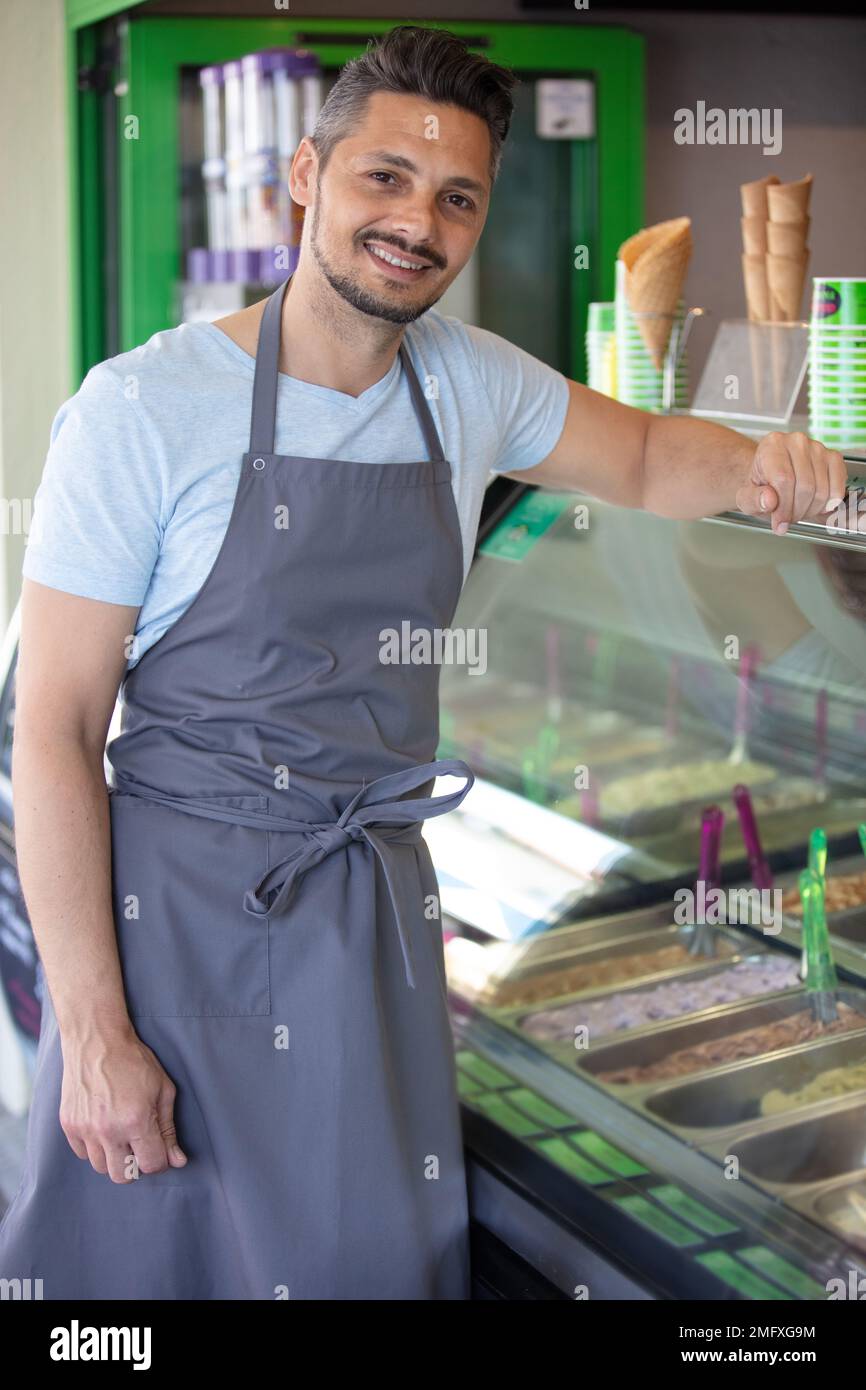 salesman smiling at the camera Stock Photo - Alamy
