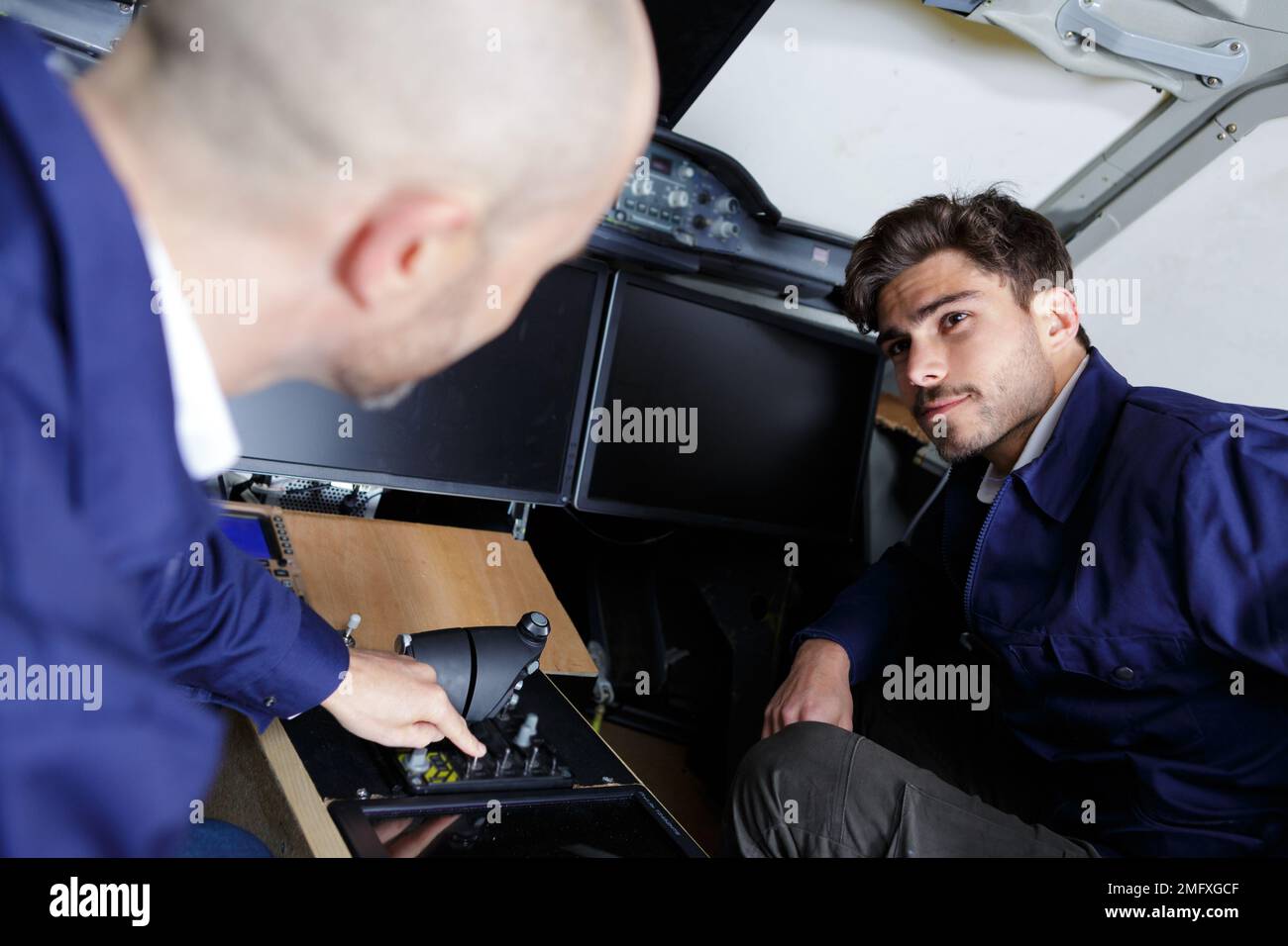 the pilots hands on the helm of the aircraft Stock Photo - Alamy