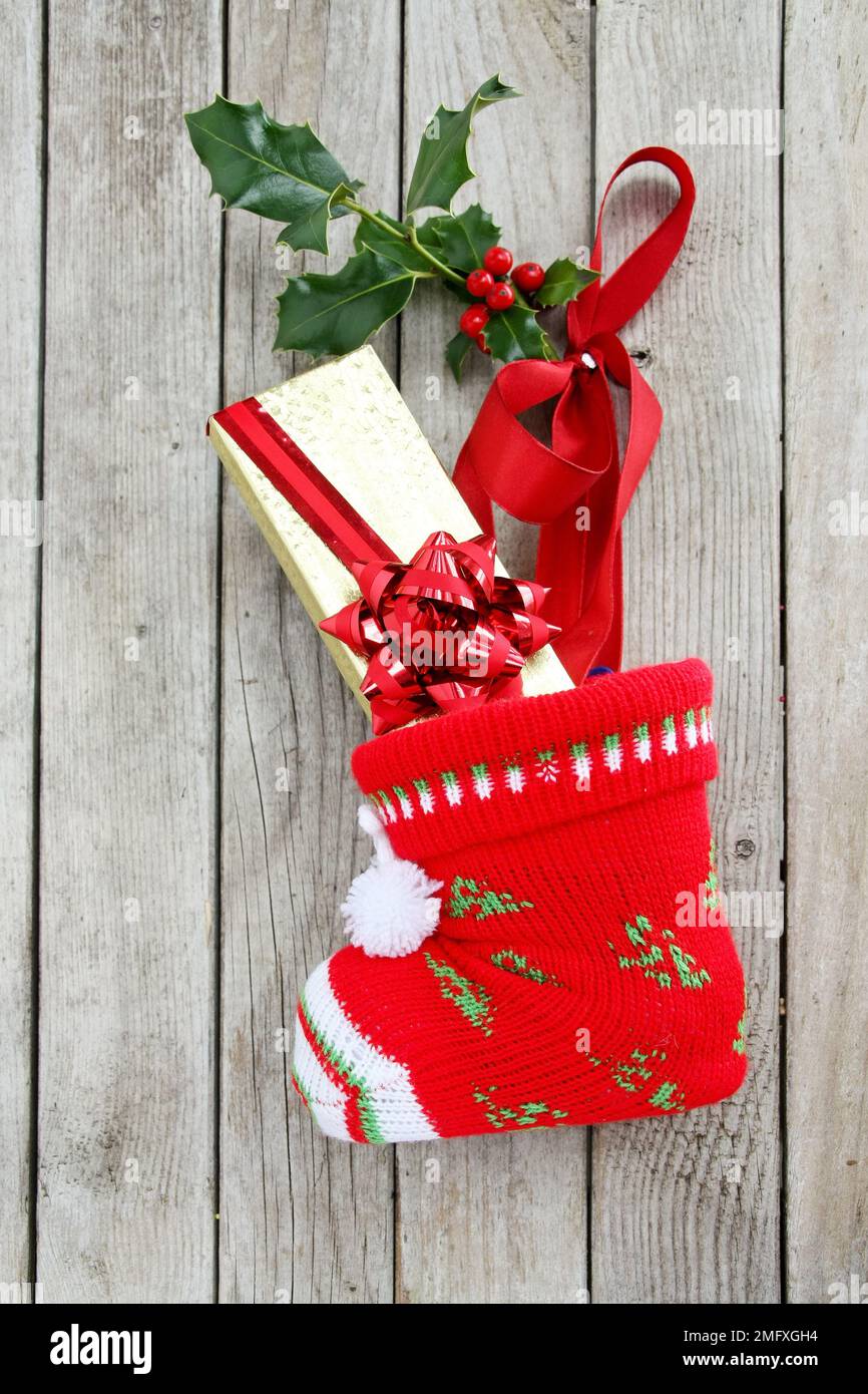 Christmas shoe with presents on wood board Stock Photo - Alamy