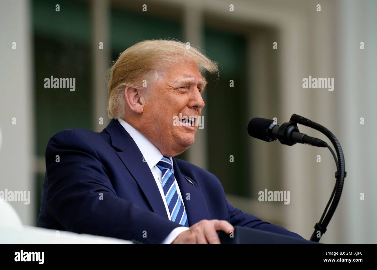 President Donald Trump speaks from the Blue Room Balcony of the White ...