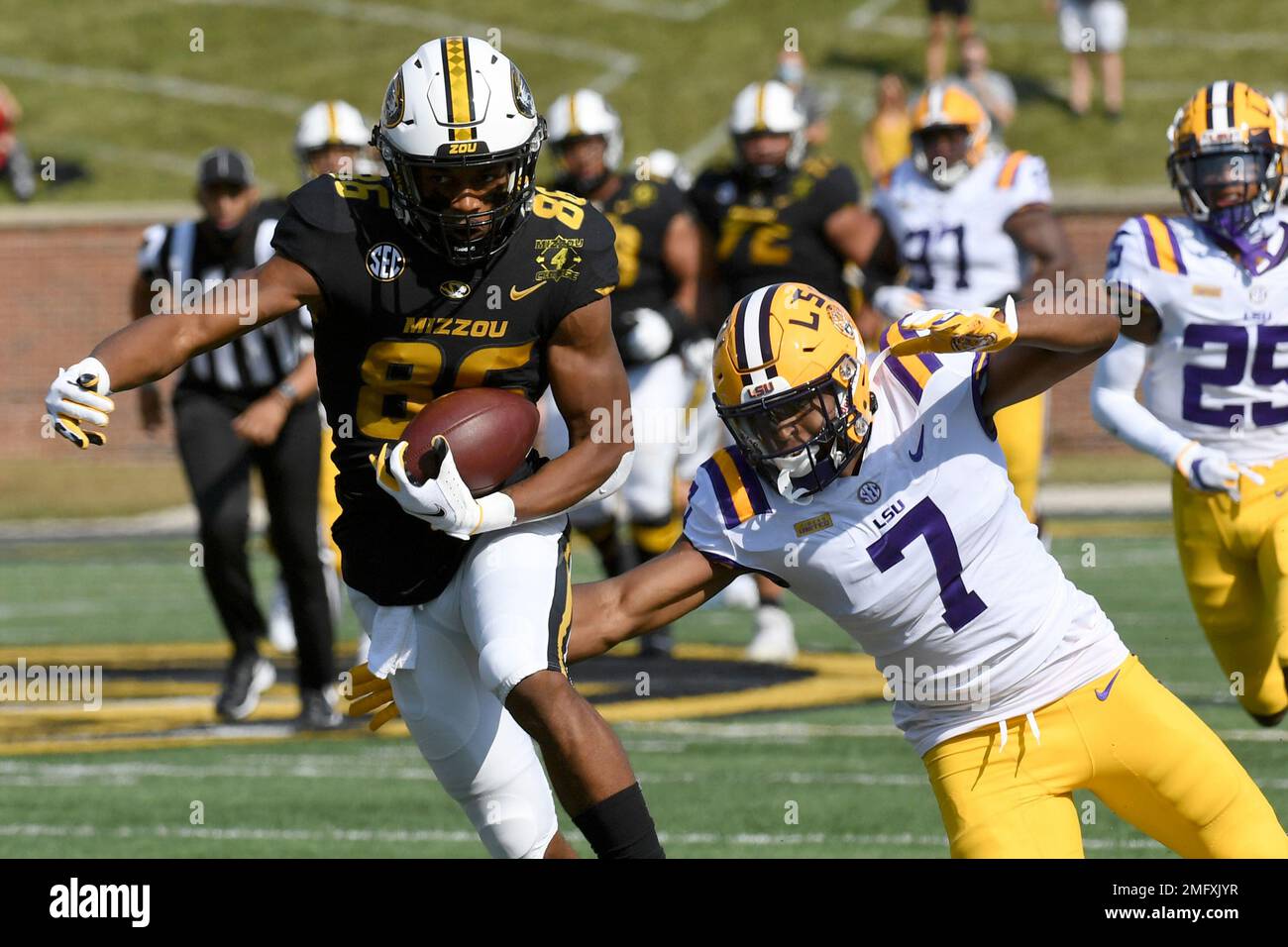 Missouri wide receiver Tauskie Dove, left, catches a touchdown pass as ...