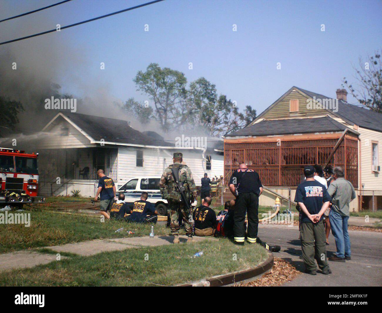 Aftermath - Miscellaneous - 26-HK-47-176. fire fighters putting out a ...