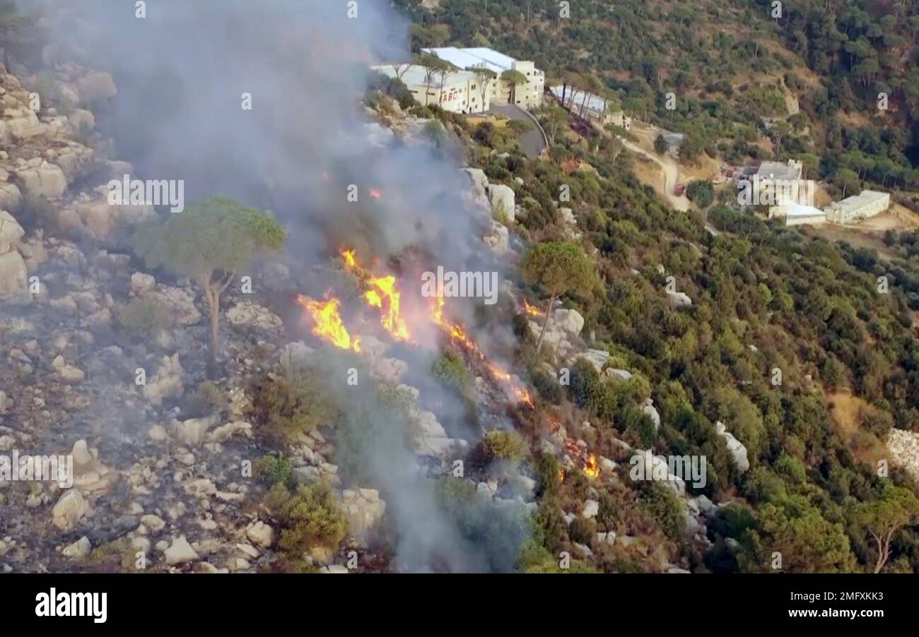 In this frame grab from video, flames rise at the scene of forest fire ...