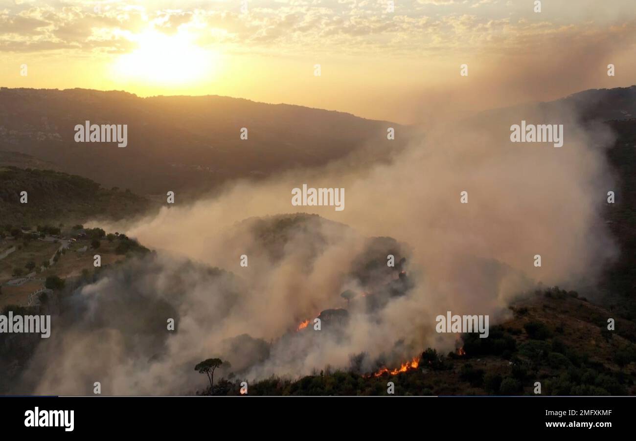 In this frame grab from video, flames rise at the scene of forest fire ...