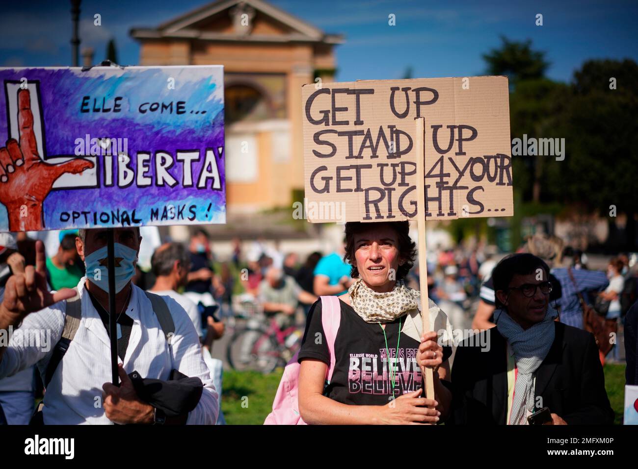 People gather to protest against the government restriction measures to ...