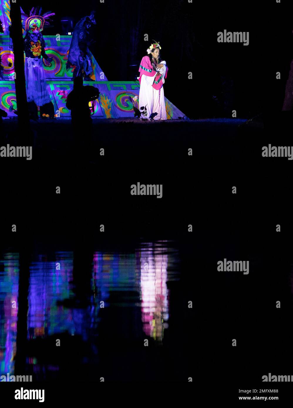 Actress Nayeli Cortes dressed as the La Llorona character, carries a ...