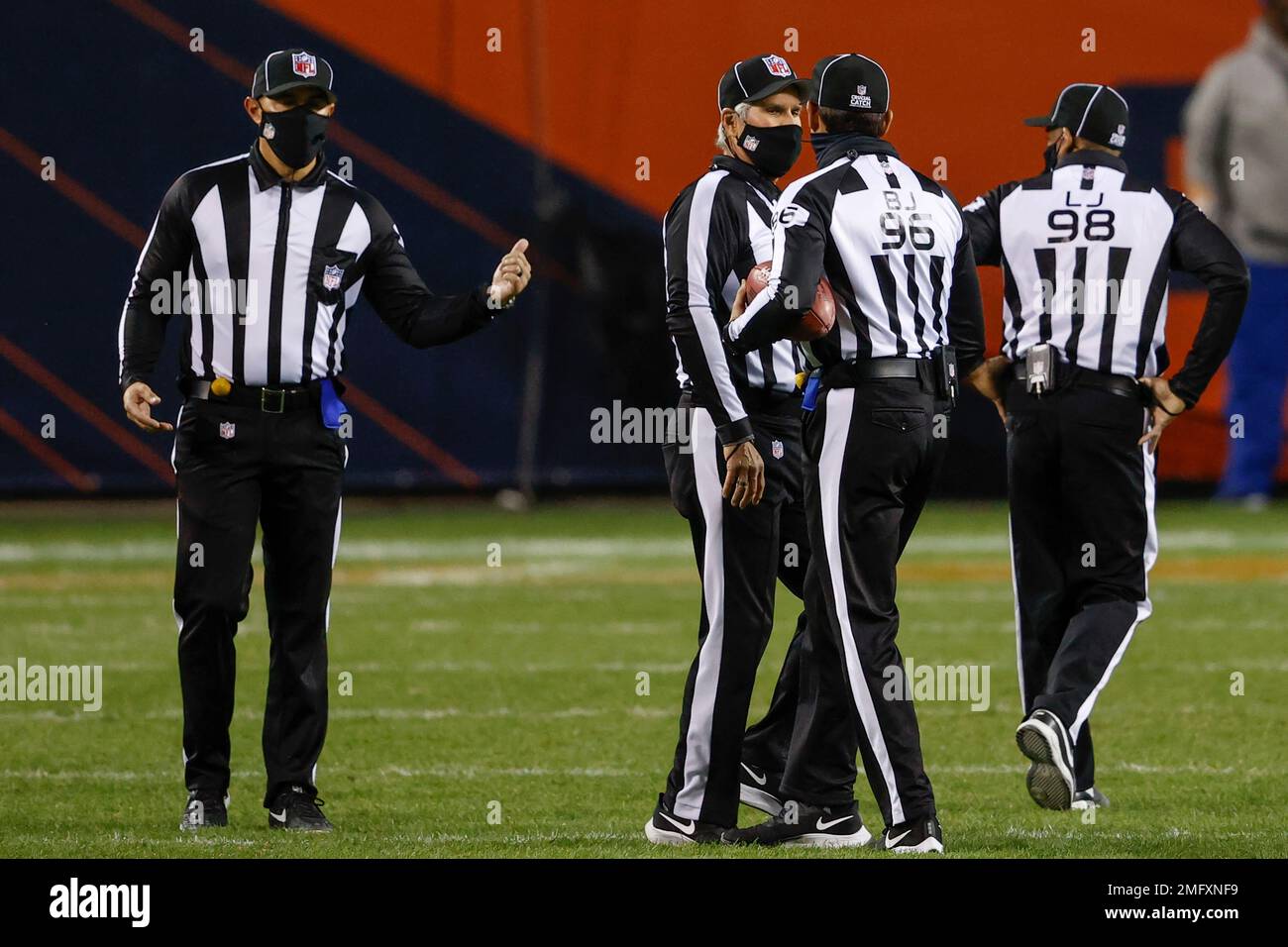 Game officials talk to each other during the first half of an NFL ...