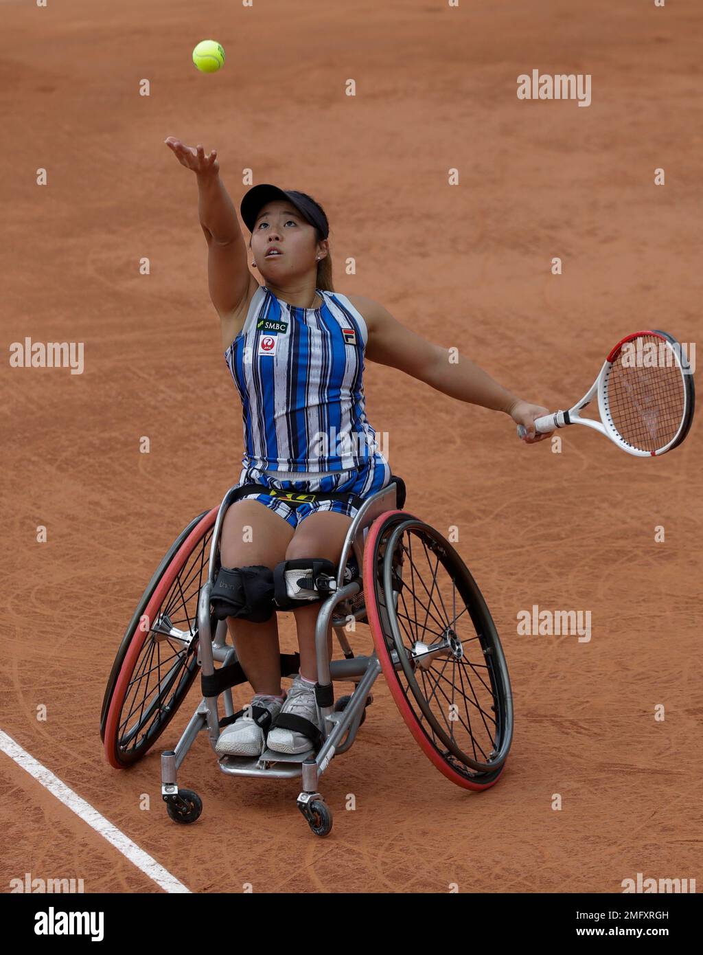 Japan's Yui Kamiji serves against Japan's Momoko Ohtani in the women's ...