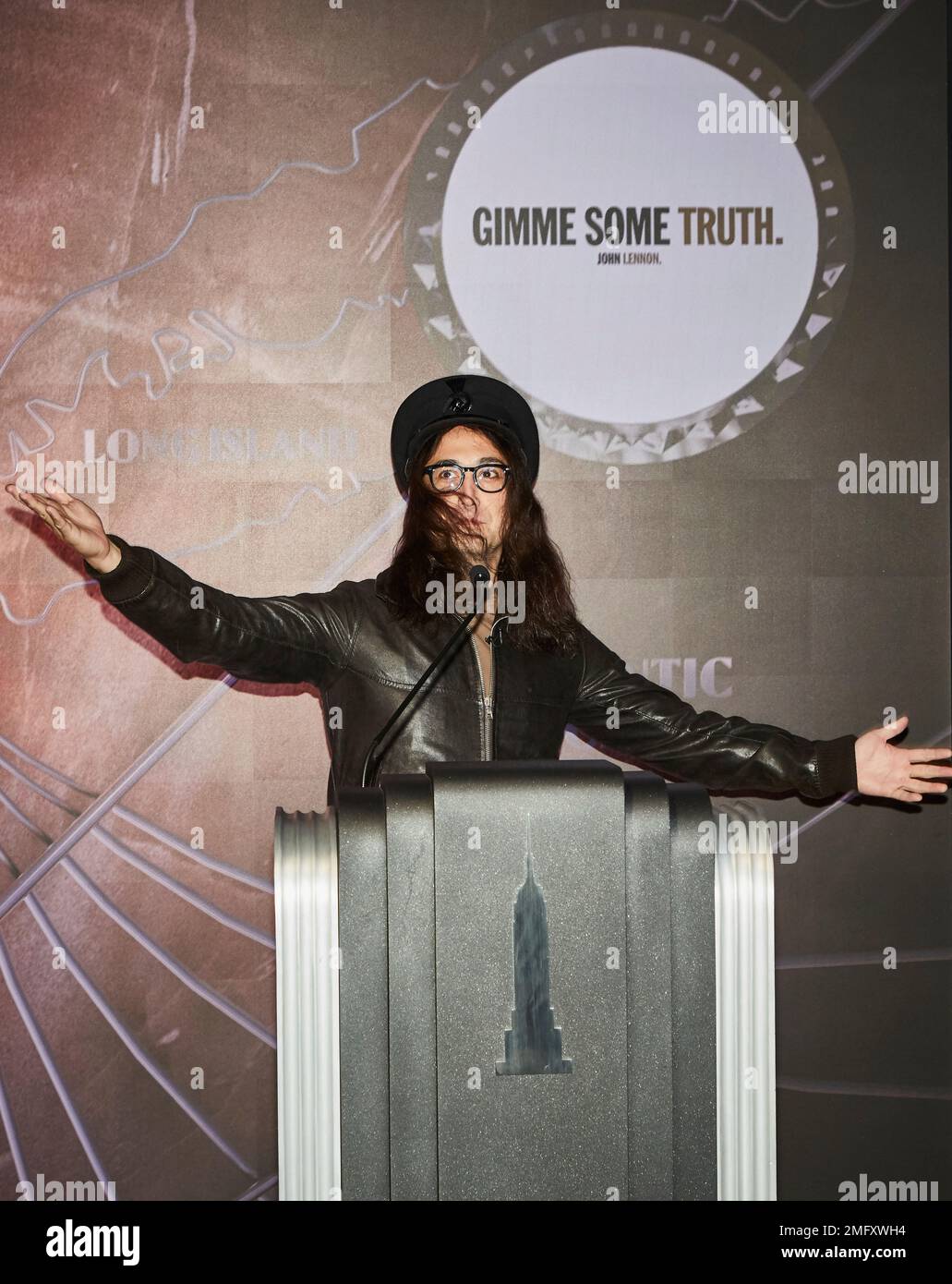 Sean Lennon stands with his arms out at the lighting ceremony of the ...
