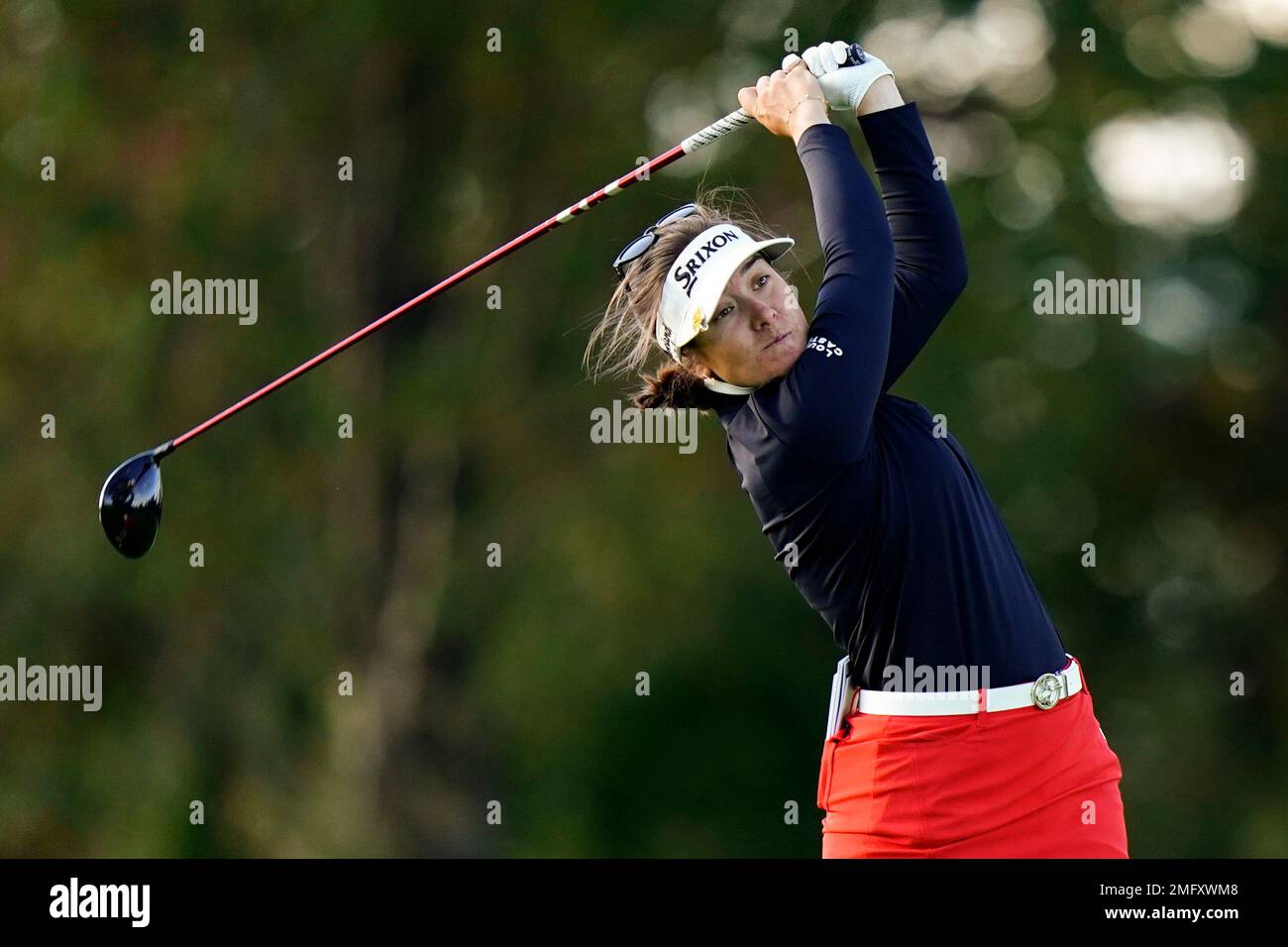 Hannah Green, of Australia, watches her tee shot on the third hole ...