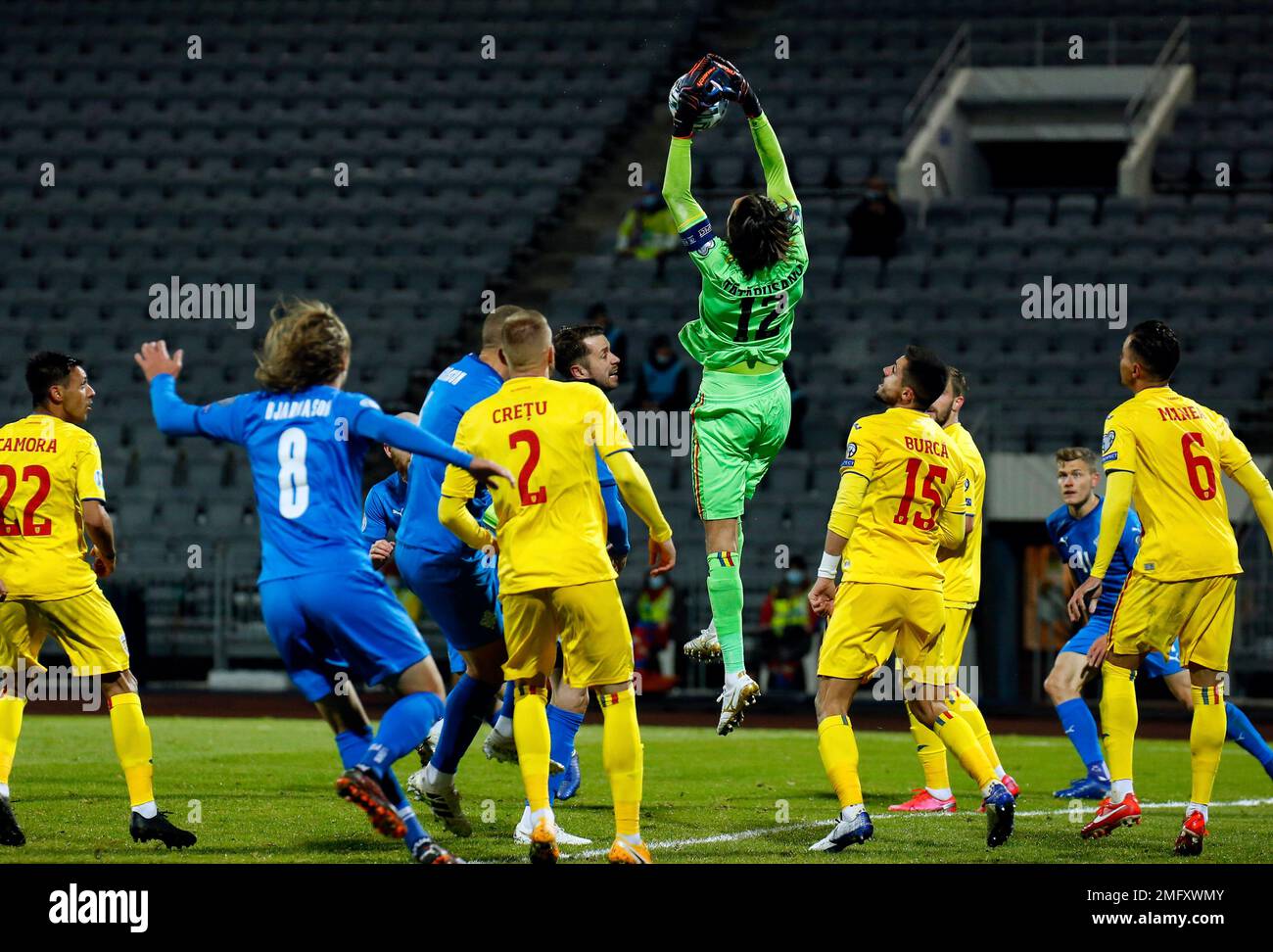 Romania's goalkeeper Ciprian Tatarusanu, center, saves from a corner ...