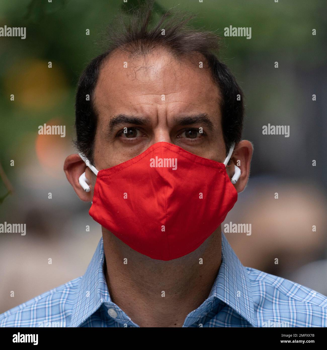 A man wears a bright red mask, Thursday, Sept. 24, 2020 in New York ...