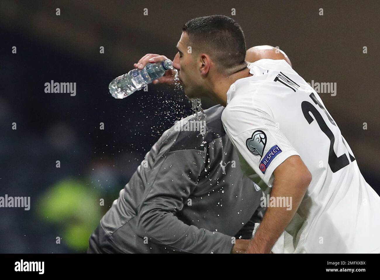 Israel's Eitan Tibi washes blood from his face after a clash during the ...