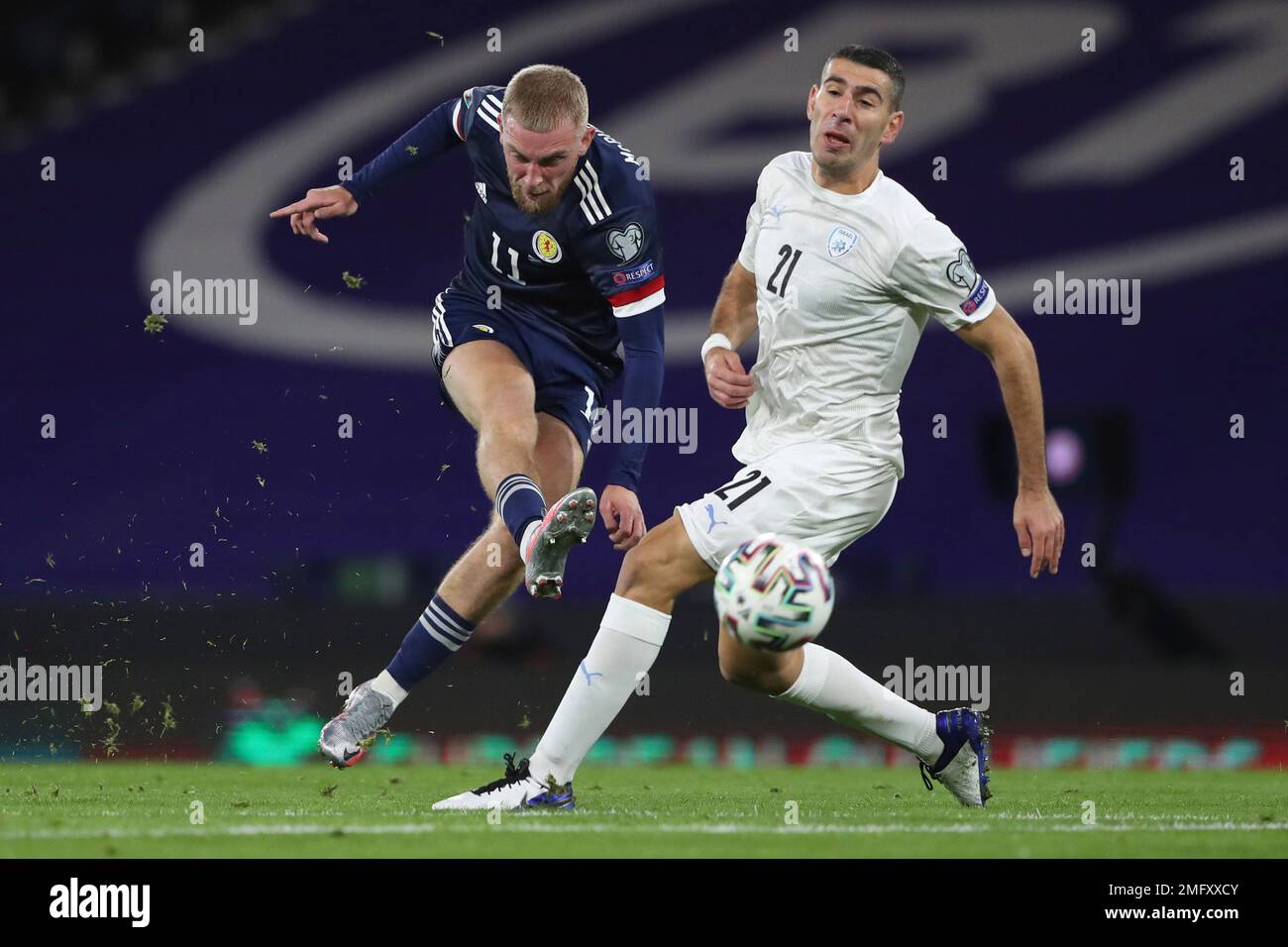 Scotland's Oli McBurnie, left, is challenged by Israel's Eitan Tibi ...