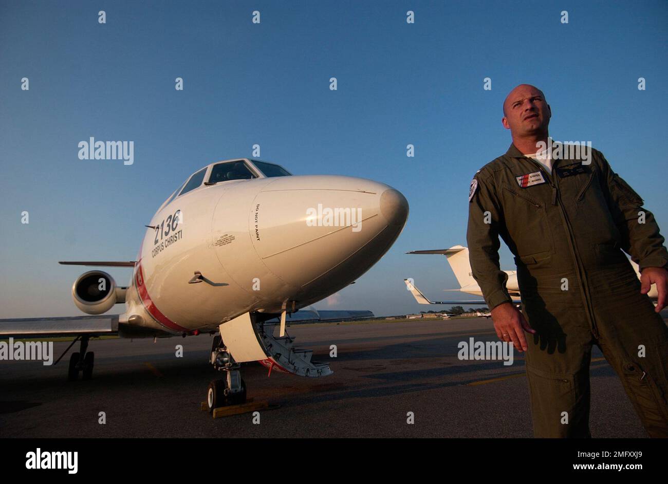 Aircrafts - HU-25 Guardian - 26-HK-55-4. Air crew member on ramp with ...
