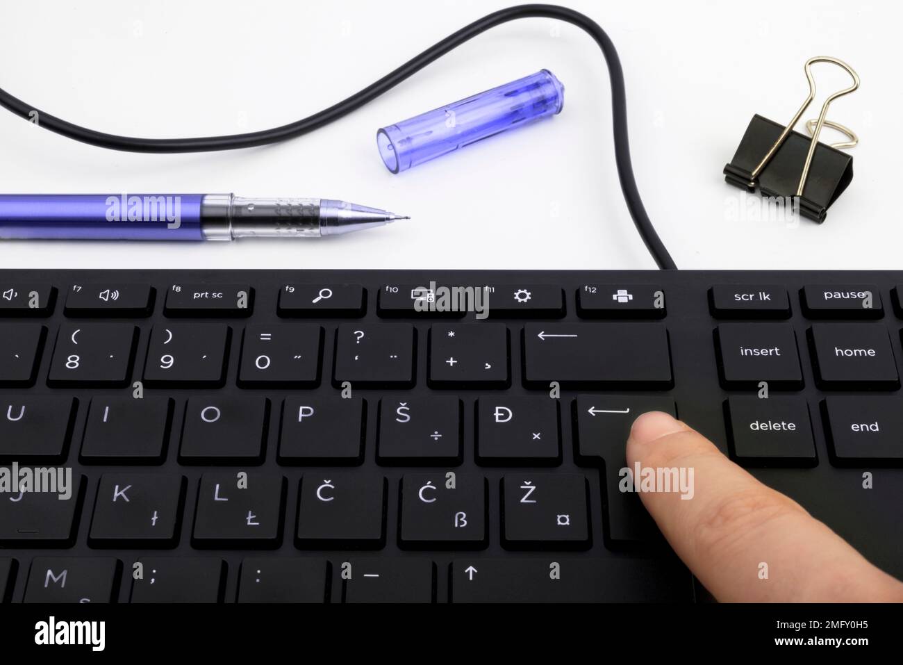 Colored paper with important message lying desk near keyboard. Main ...