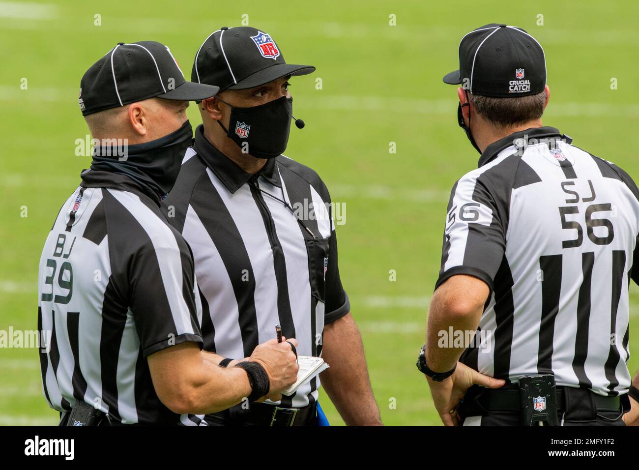 From left, back judge Rich Martinez, field judge Tra Blake and side ...