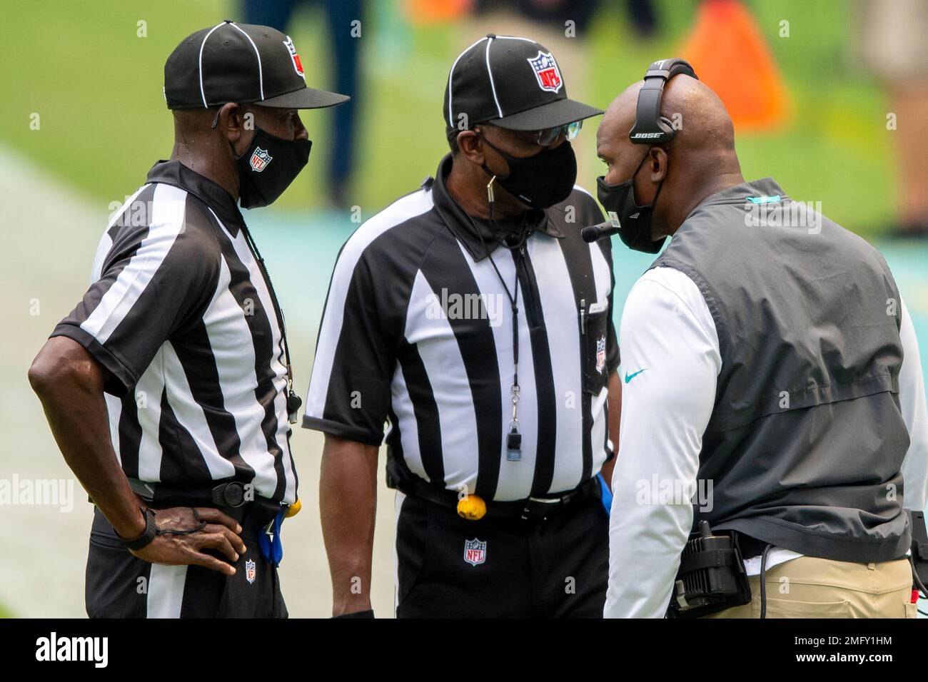 From left, umpire Roy Ellison, line judge Roy Symonette speak with ...