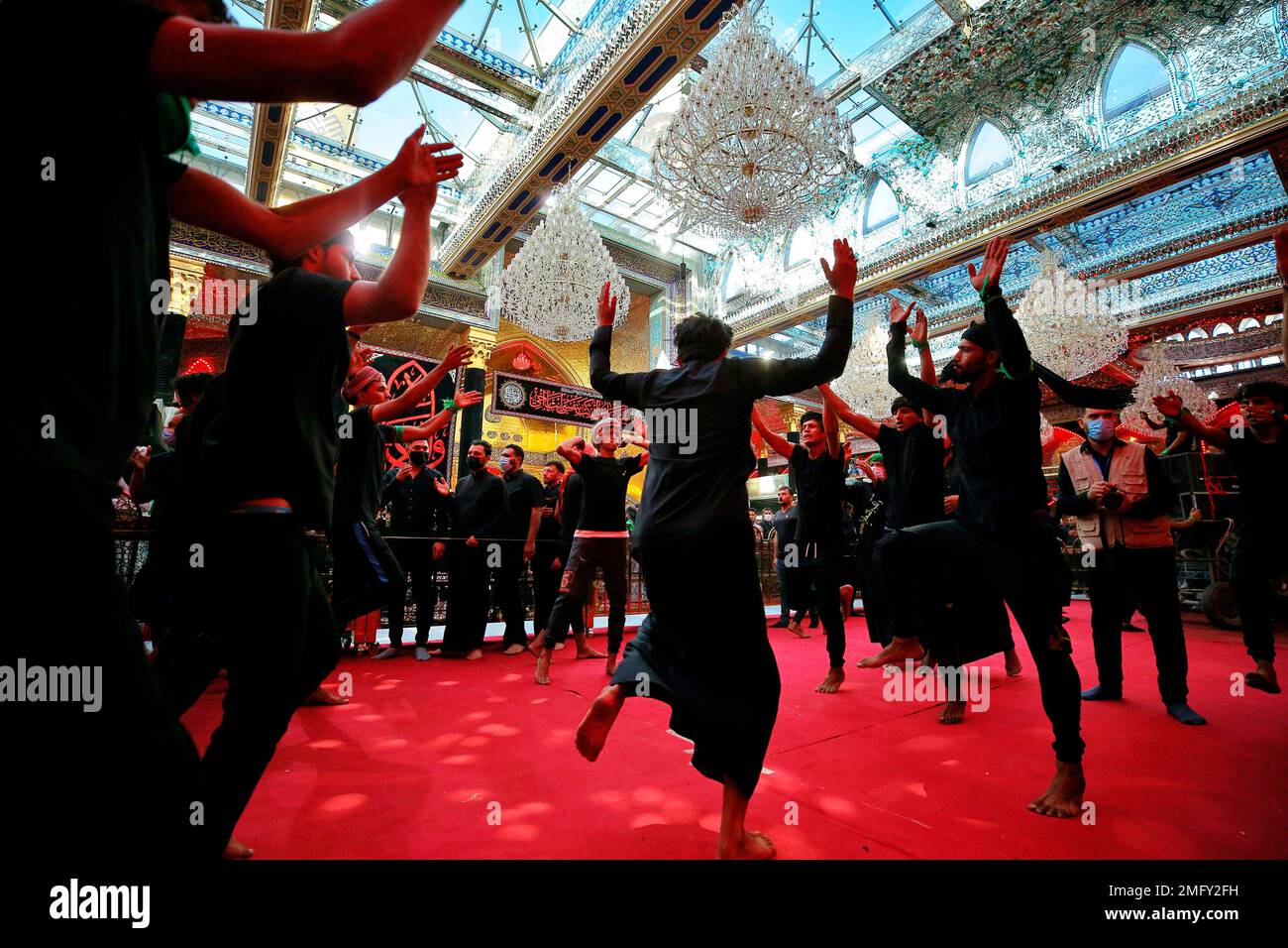 Shiite worshippers gather inside the holy shrine of Imam Abbas ahead of ...