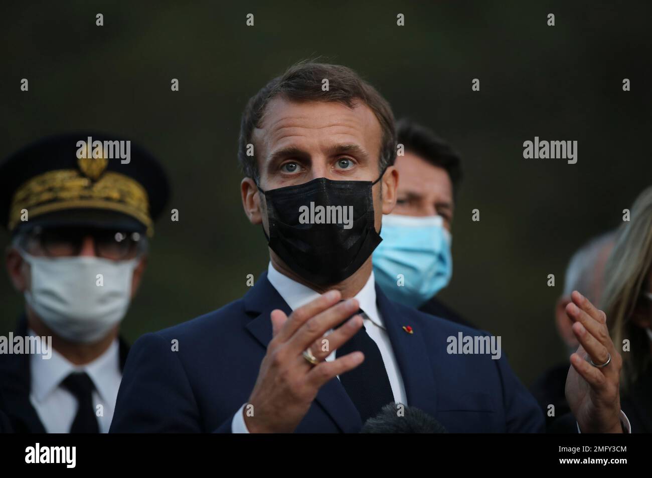 French President Emmanuel Macron delivers his speech in Breil-sur-Roya ...