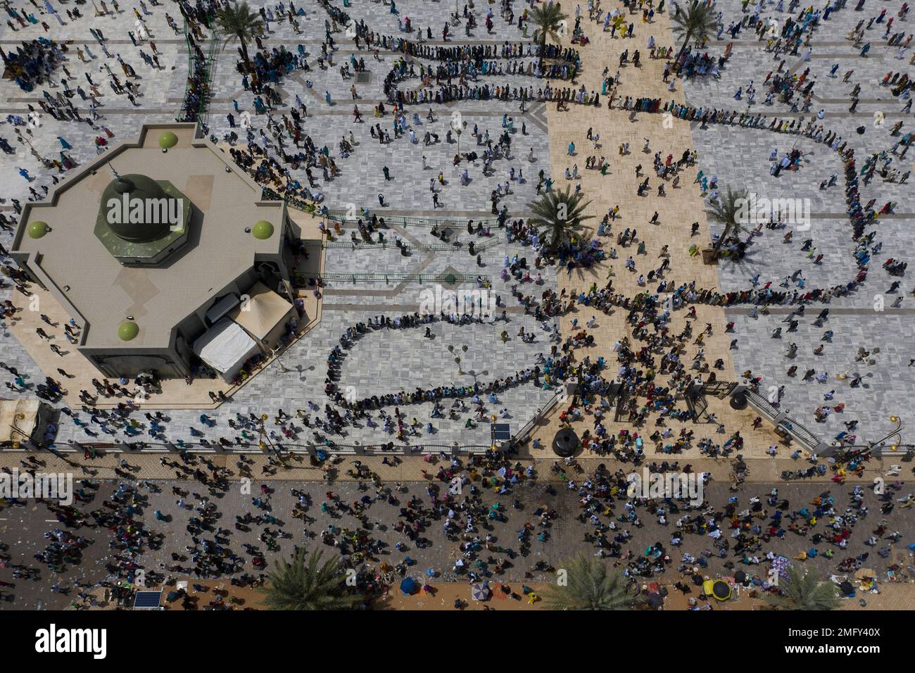 In this aerial photo taken with a drone, pilgrims from the Mouride ...