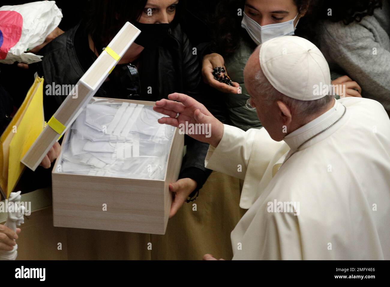Pope Francis blesses face masks that were put in a box by faithful, on ...