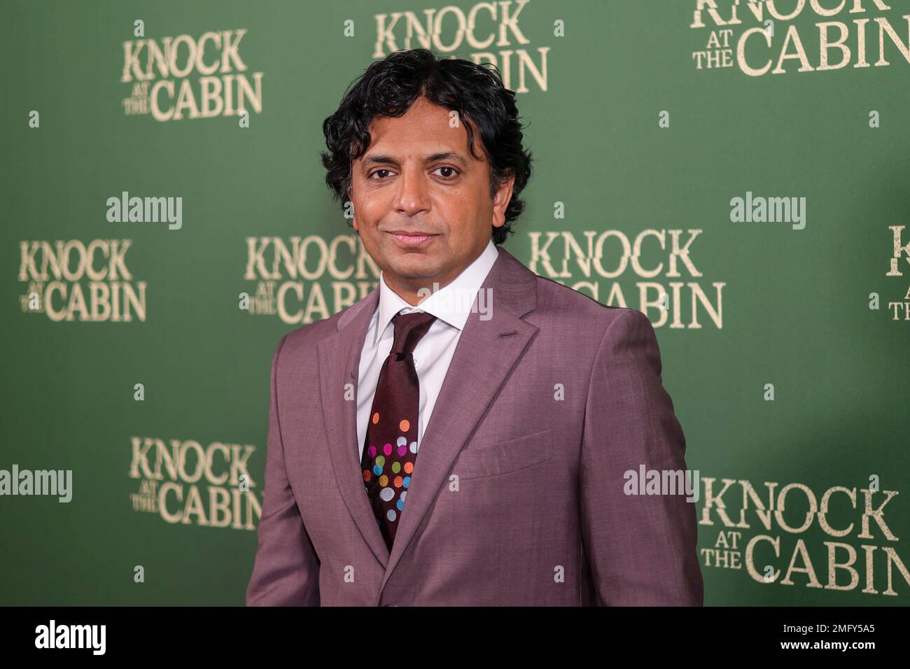 Director M. Night Shyamalan poses for photographers upon arrival at the ...