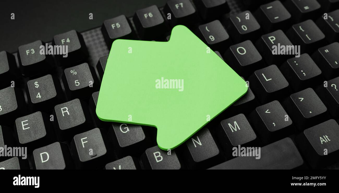 Sticker lying on black keyboard. Important message written over paper ...