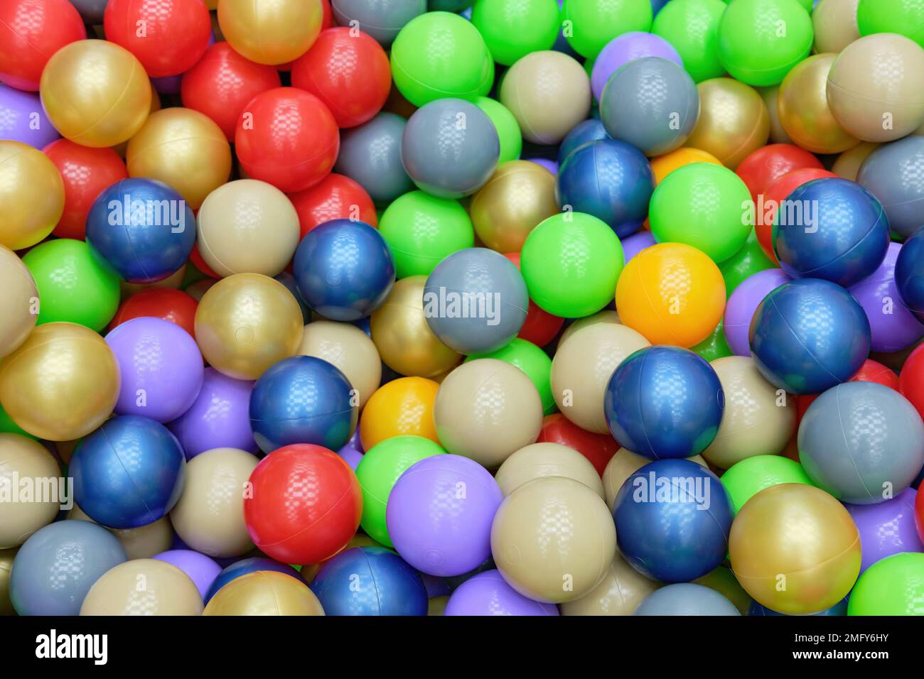 A bunch of colorful plastic balls in the game center. View from above ...