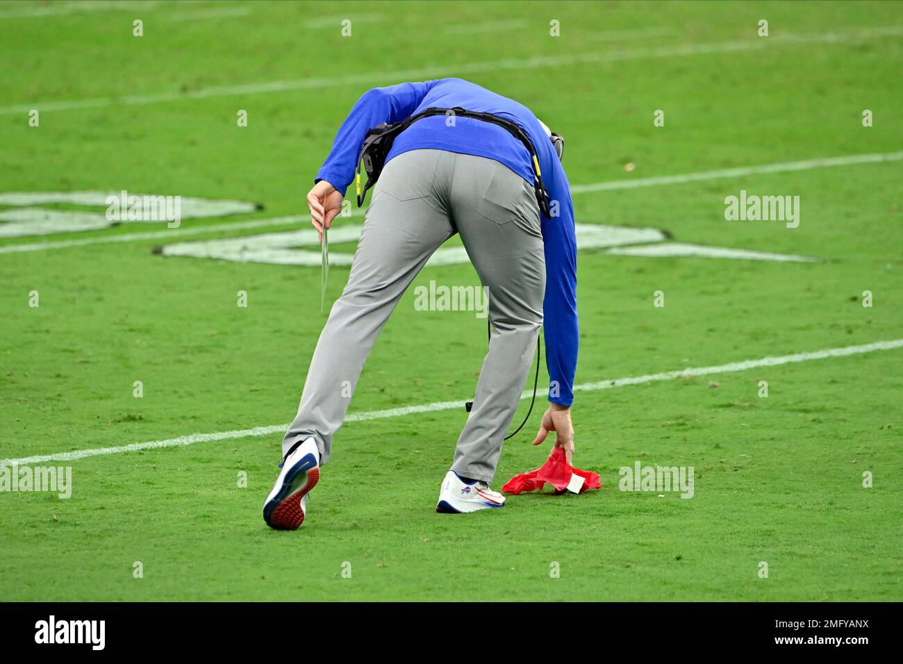 Buffalo Bills coach Sean McDermott retrieves the challenge flag after ...