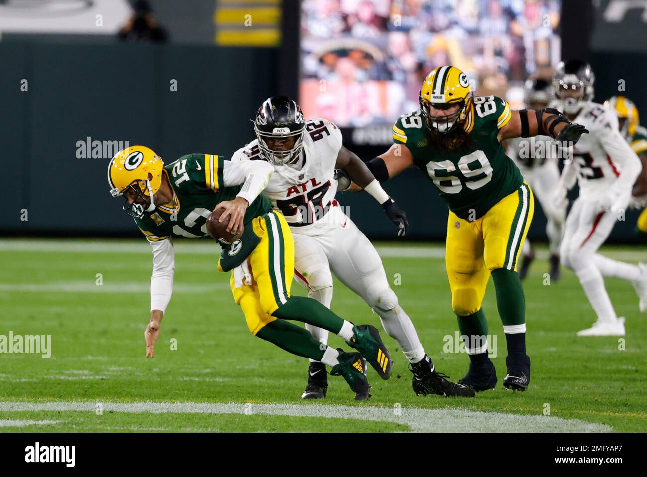 Green Bay Packers quarterback Aaron Rodgers (12) is tackled by Atlanta ...