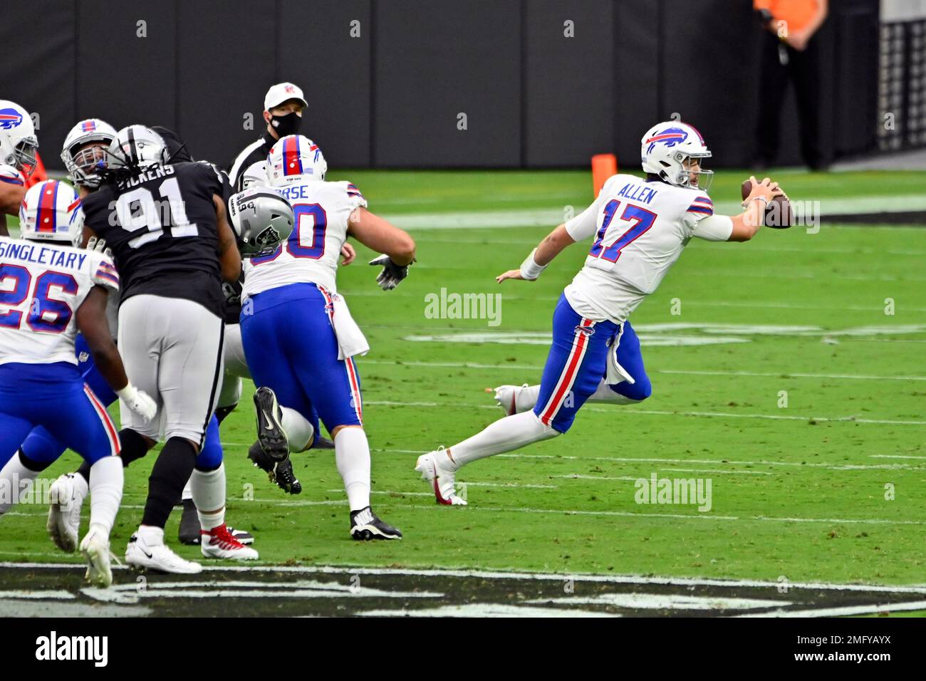 Buffalo Bills quarterback Josh Allen (17) scrambles with the ball of an ...