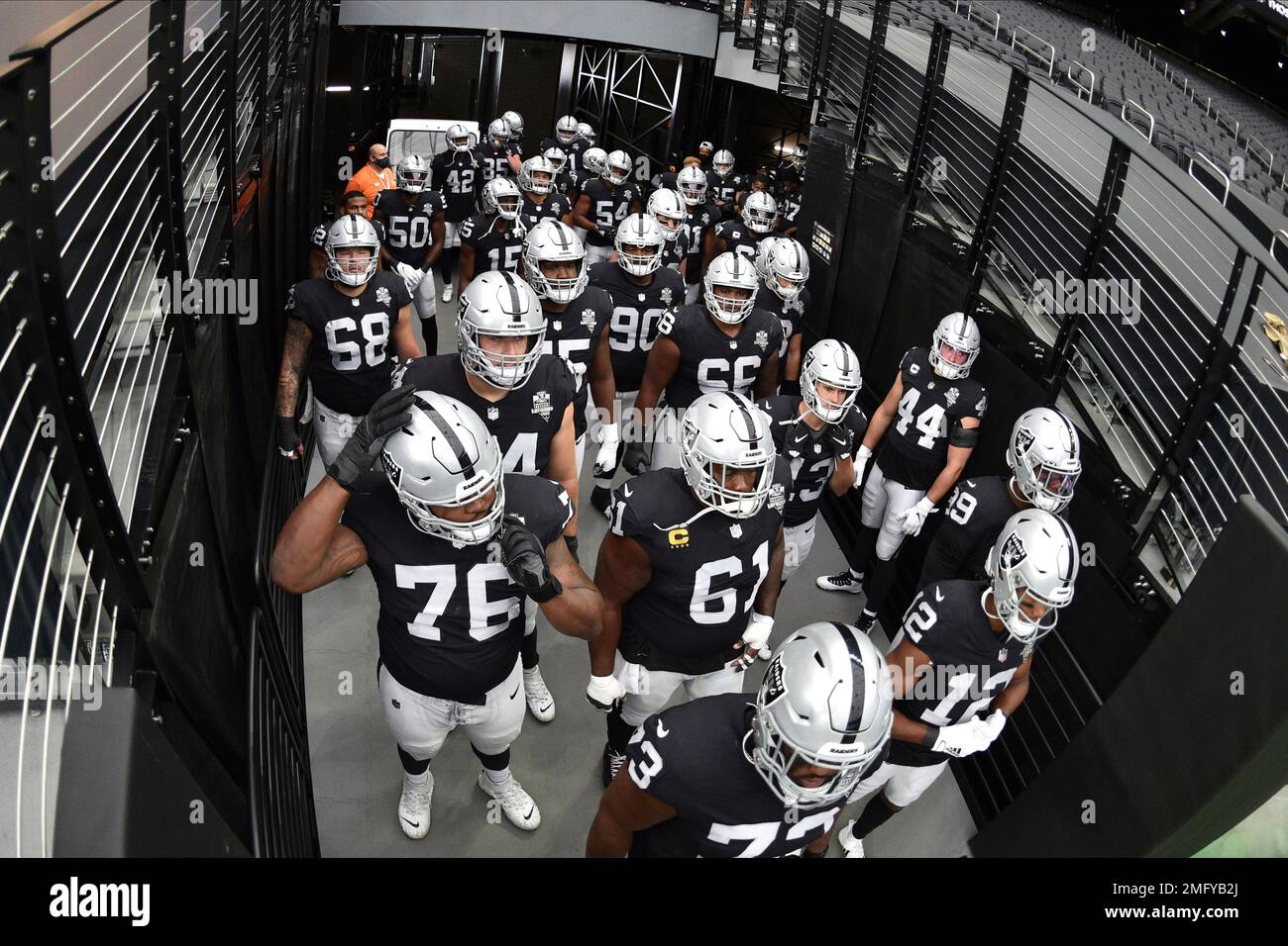 The Las Vegas Raiders line up before taking the field for their NFL ...