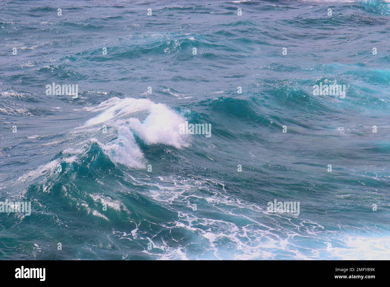 Small waves in the Pacific Ocean off the coast of Kauai, Hawaii, USA in ...