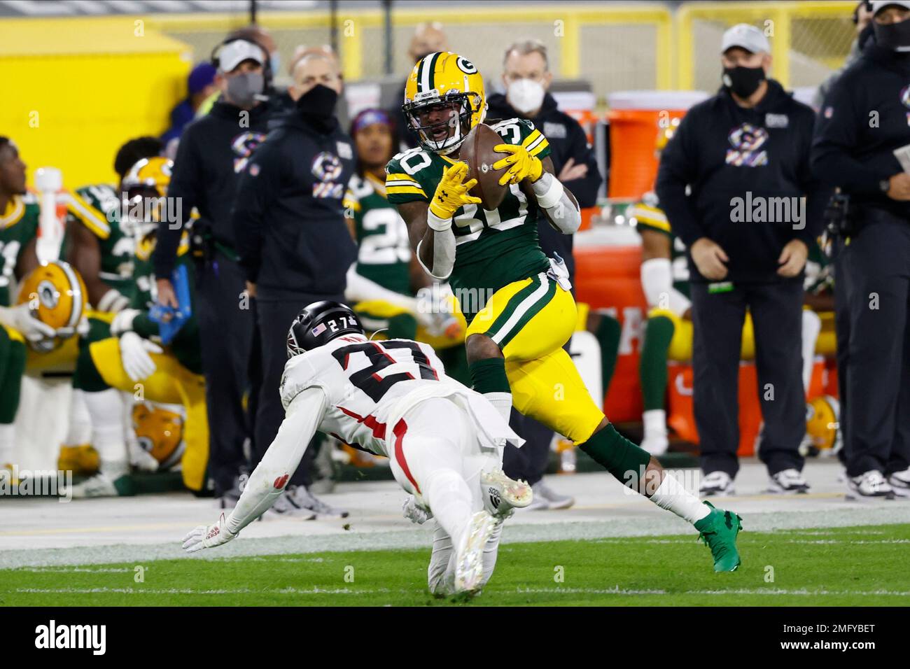 Green Bay Packers' Jamaal Williams (30) is tackled by Atlanta Falcons ...