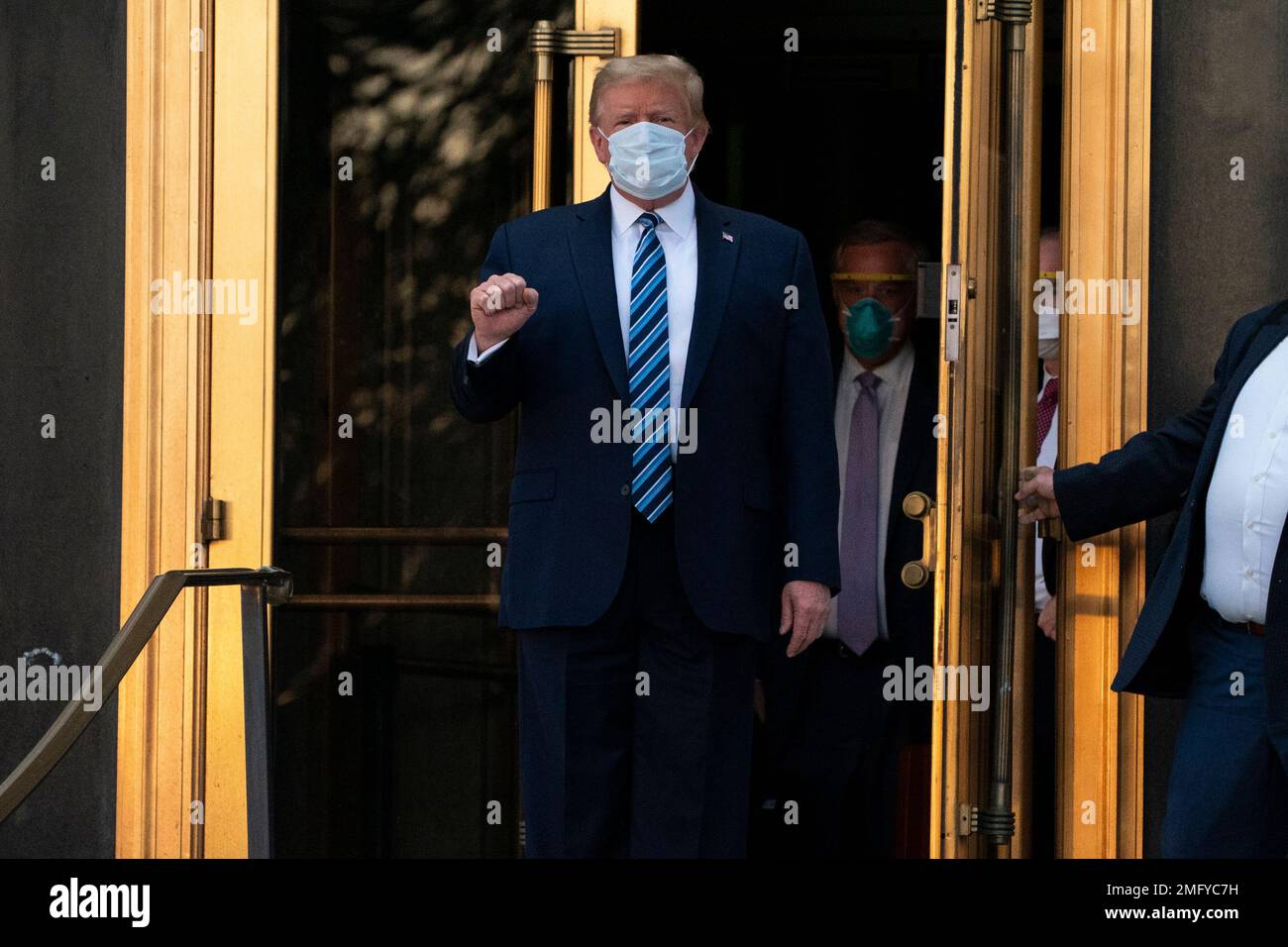 President Donald Trump walks out of Walter Reed National Military ...